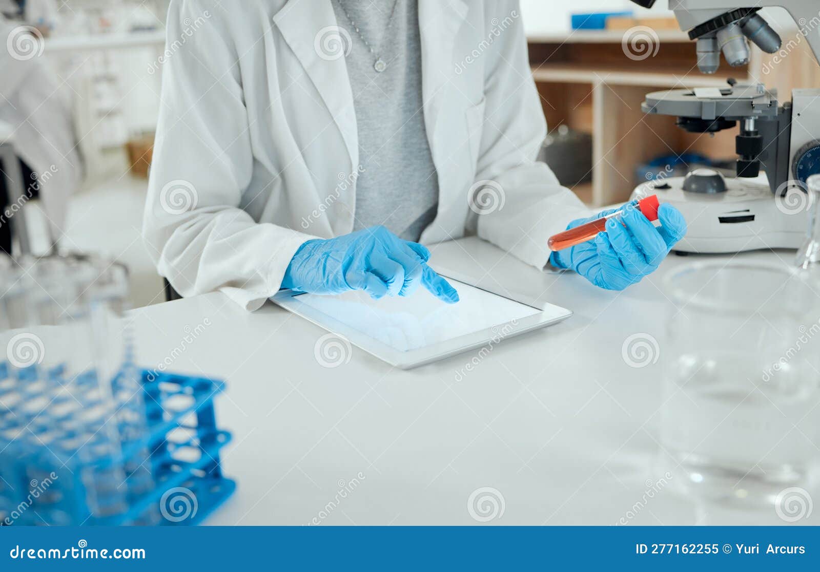 Documenting Our Progress Digitally. a Scientist Holding a Sample while ...
