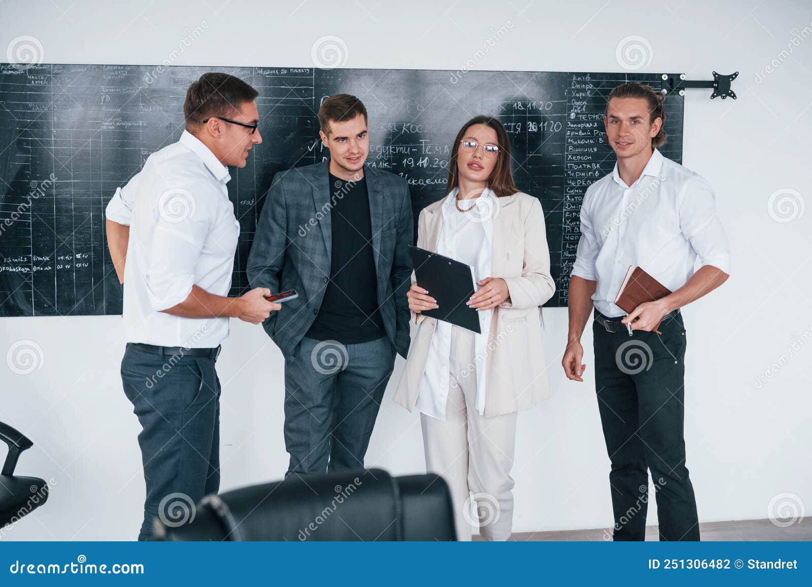 With Documents in Hands. Group of Young Smart People that Standing Near ...