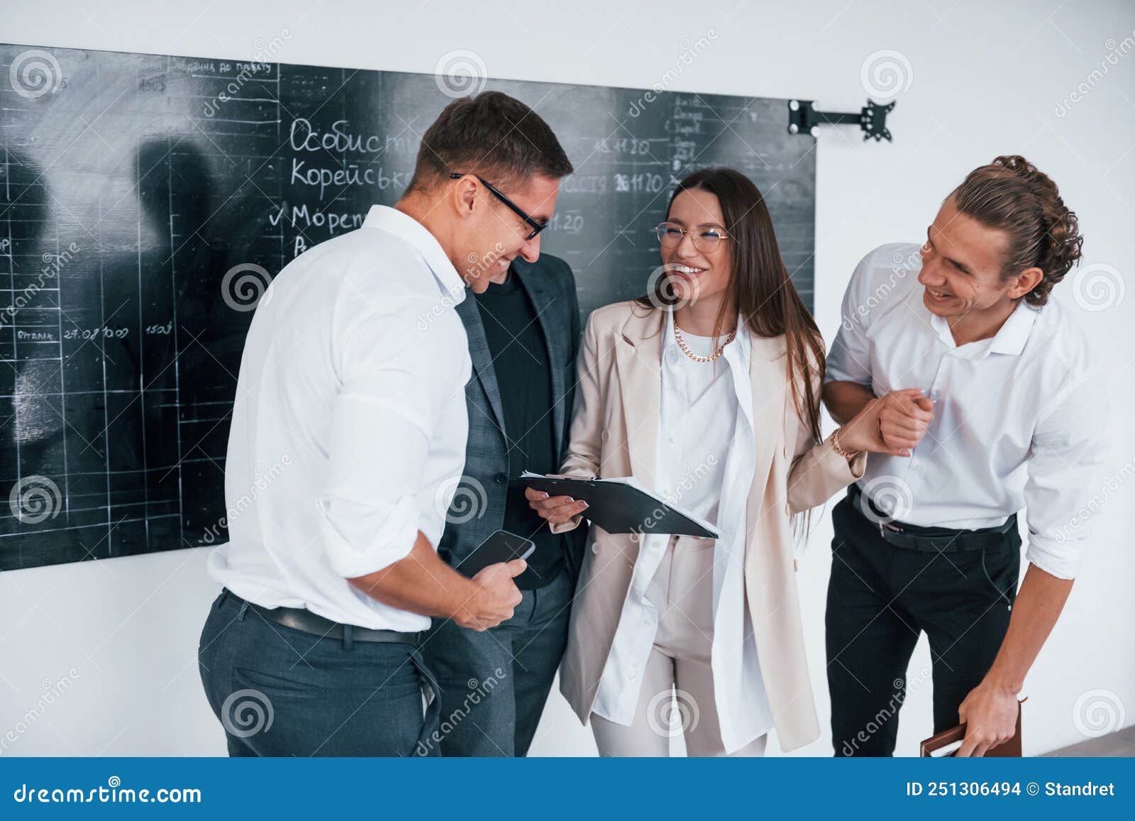 With Documents in Hands. Group of Young Smart People that Standing Near ...