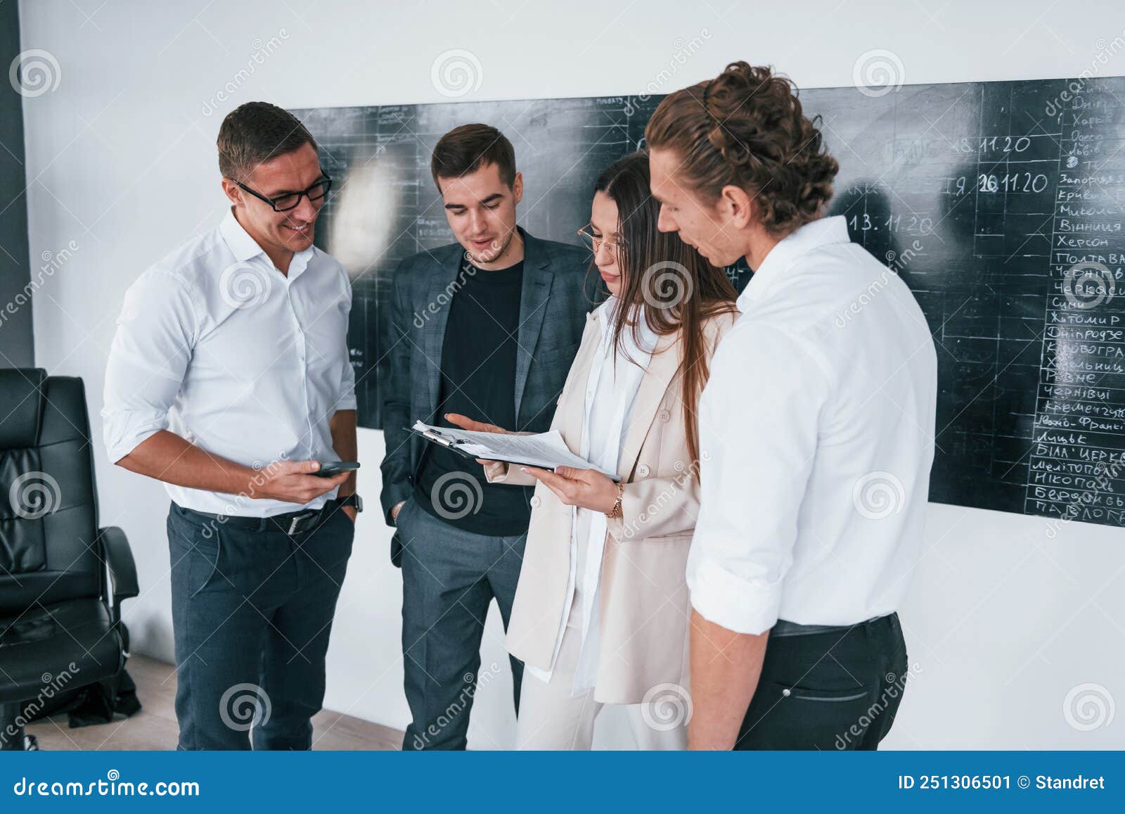 With Documents in Hands. Group of Young Smart People that Standing Near ...