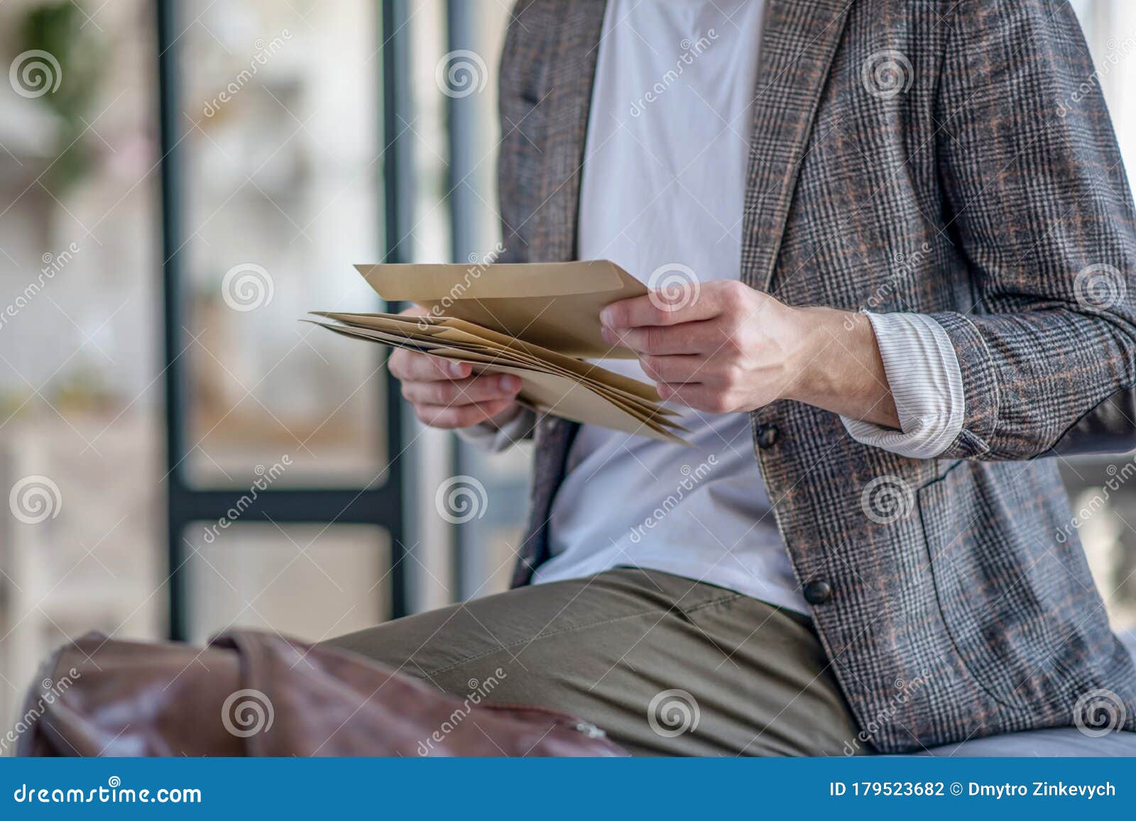 Stylish Man Sitting and Opening the Envelope Stock Photo - Image of ...