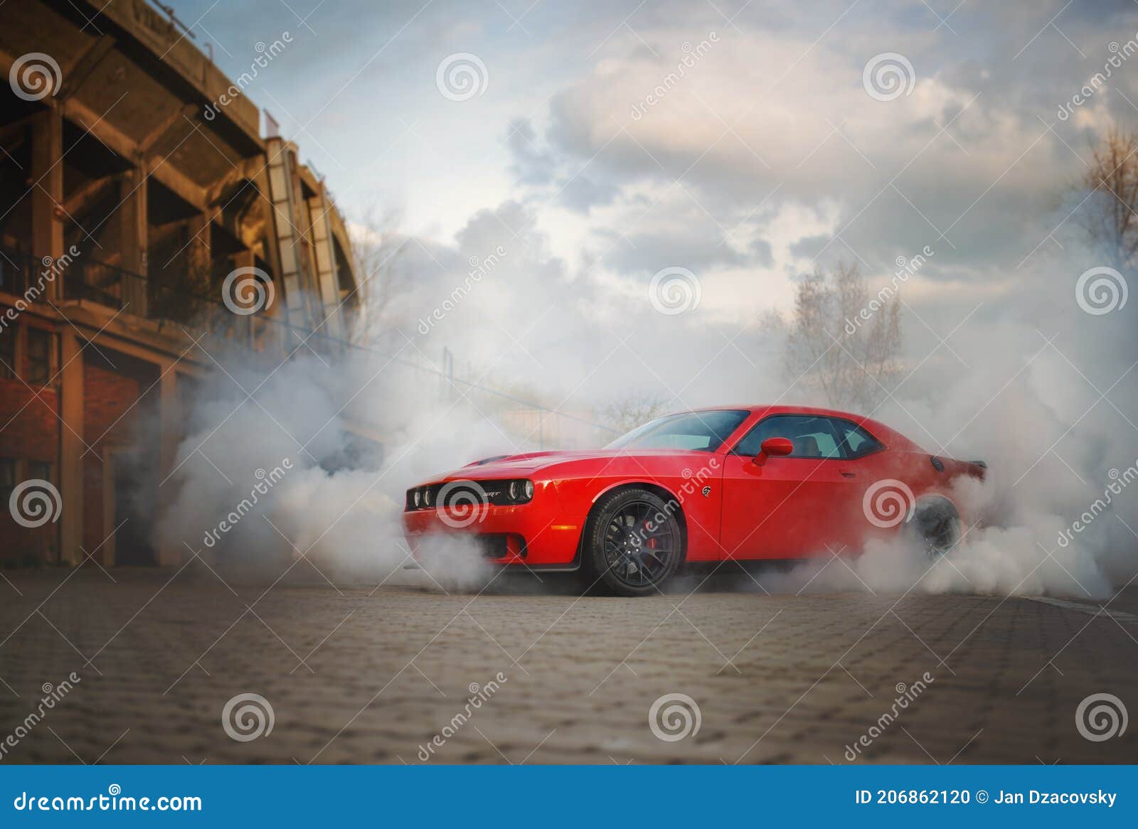 Dodge Challenger Srt Hellcat Shrouded In Smoke From Its Burning Tires