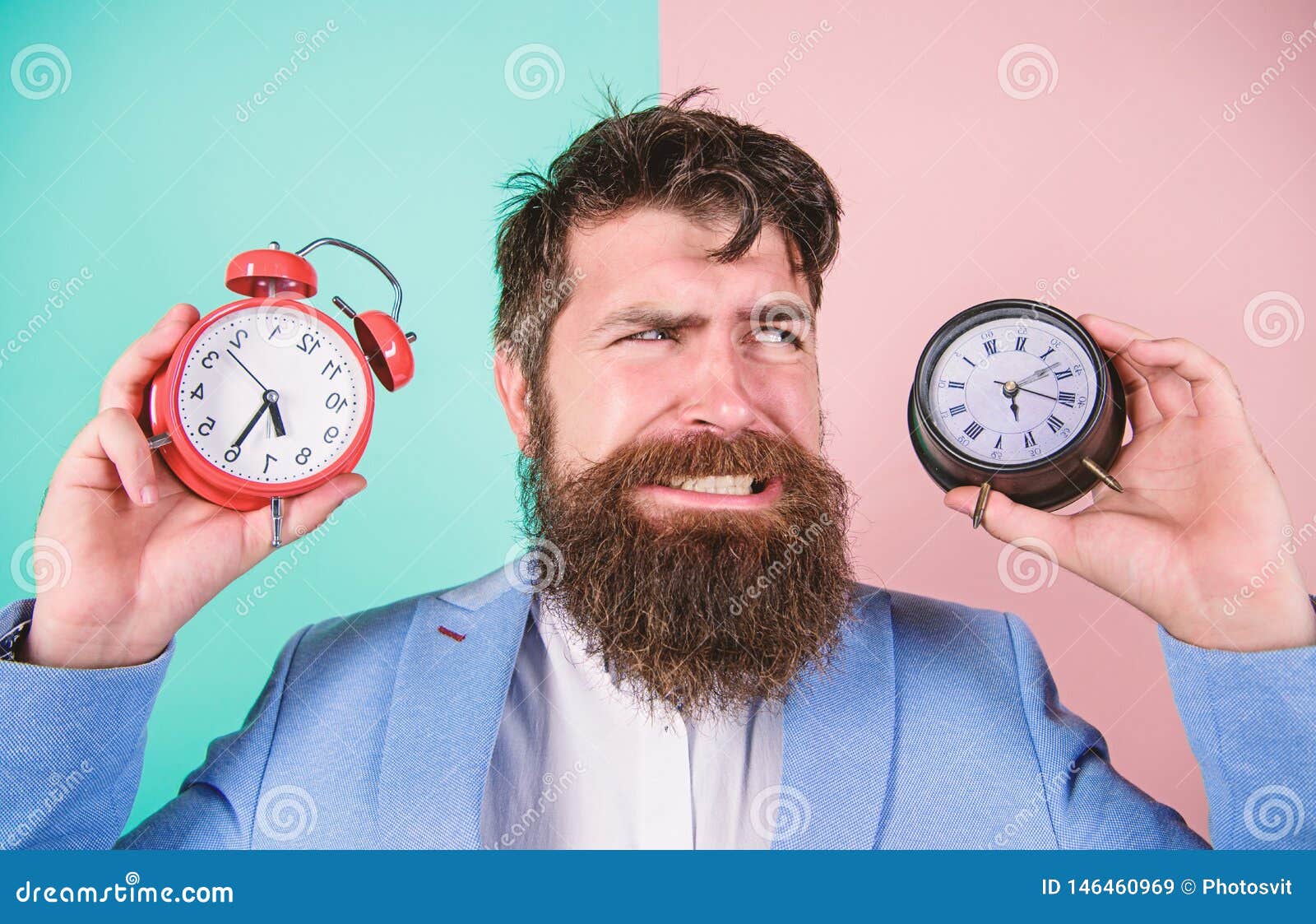 Does Changing Clock Mess With Your Health. Man Bearded Hipster Hold Two ...