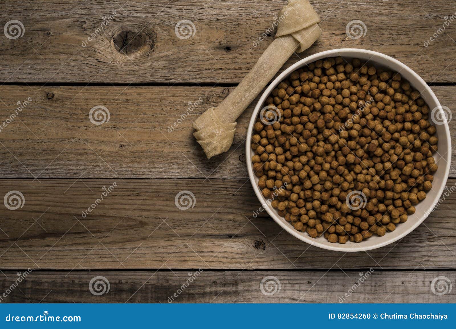 Dog Bone and Dog Food on Wood Table Stock Photo - Image of bone ...