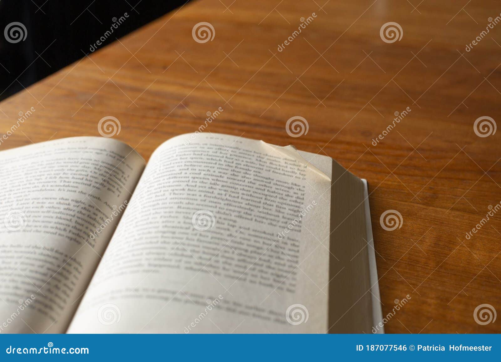 A Dog Eared Page in a Paperback on Table Stock Photo - Image of ...