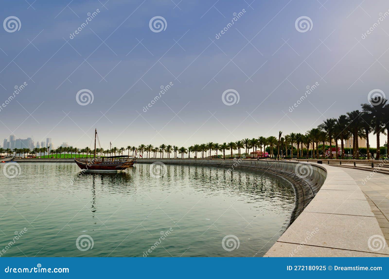Doha corniche stock image. Image of corniche, boat, monument - 272180925