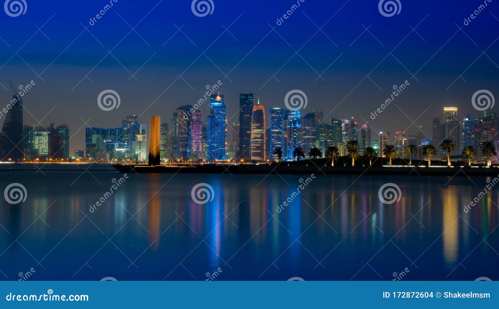 Doha Skyline during the Evening with Colorful Towers Stock Photo ...