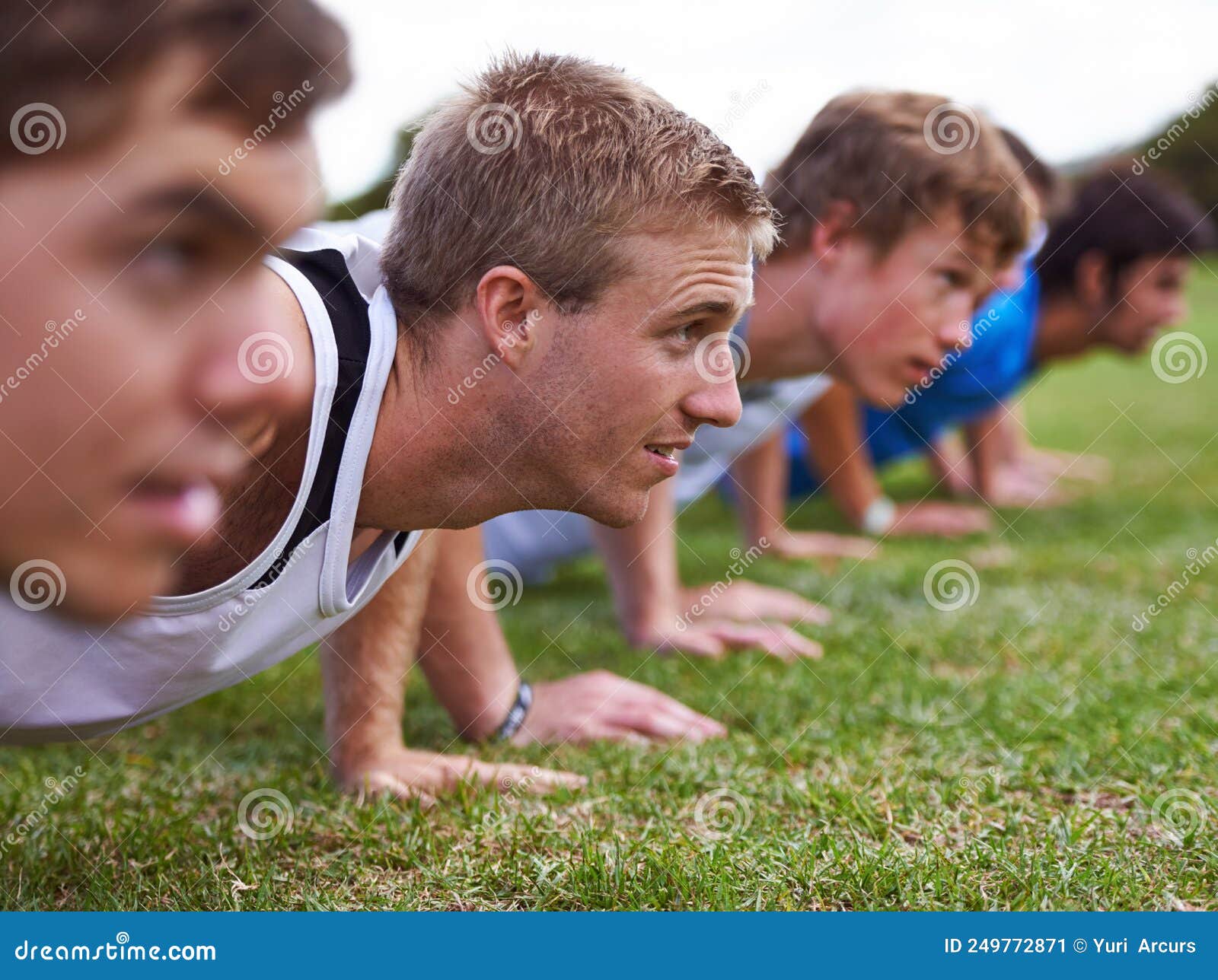 Doing the Best they Can. Shot of a Group of Young Sportsmen Training ...