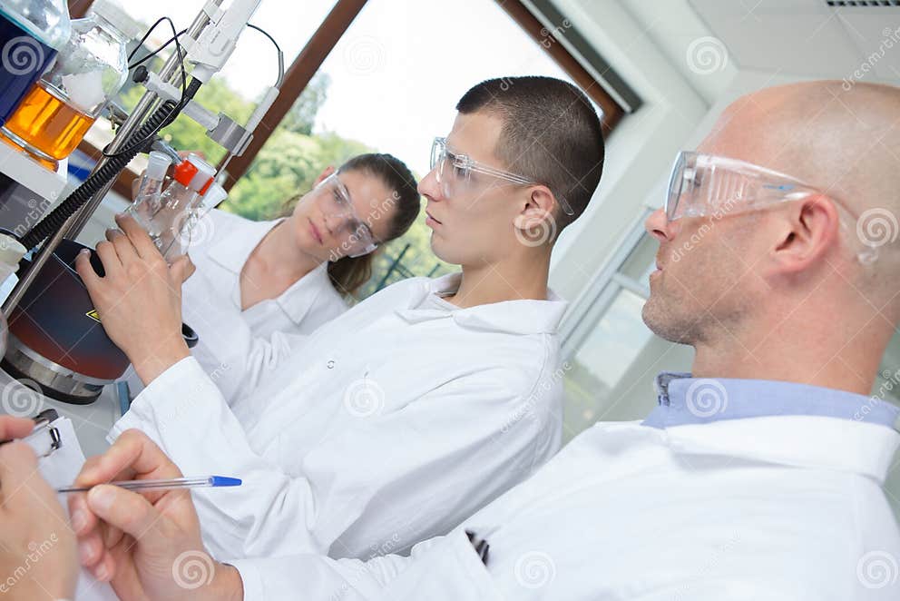 Doing experiments at lab stock image. Image of protection - 100306313