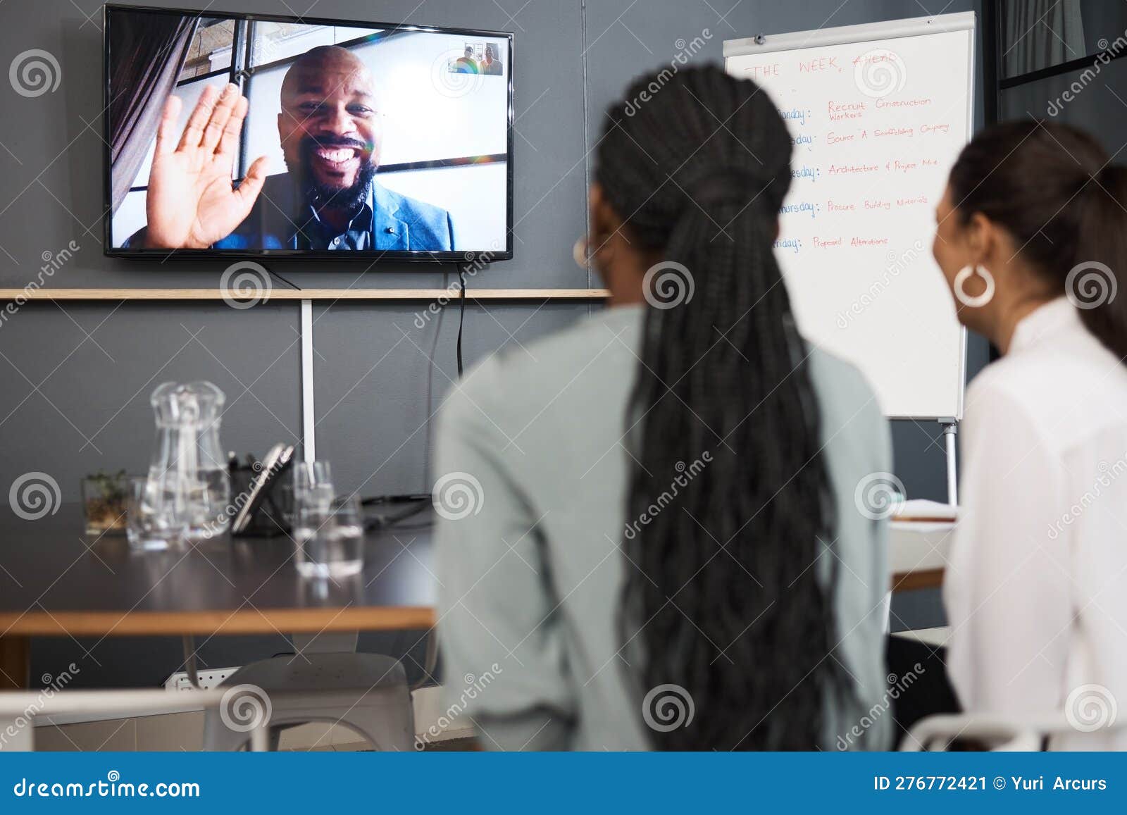 Doing Great. a Group of Businesspeople Having a Video Conference in an ...