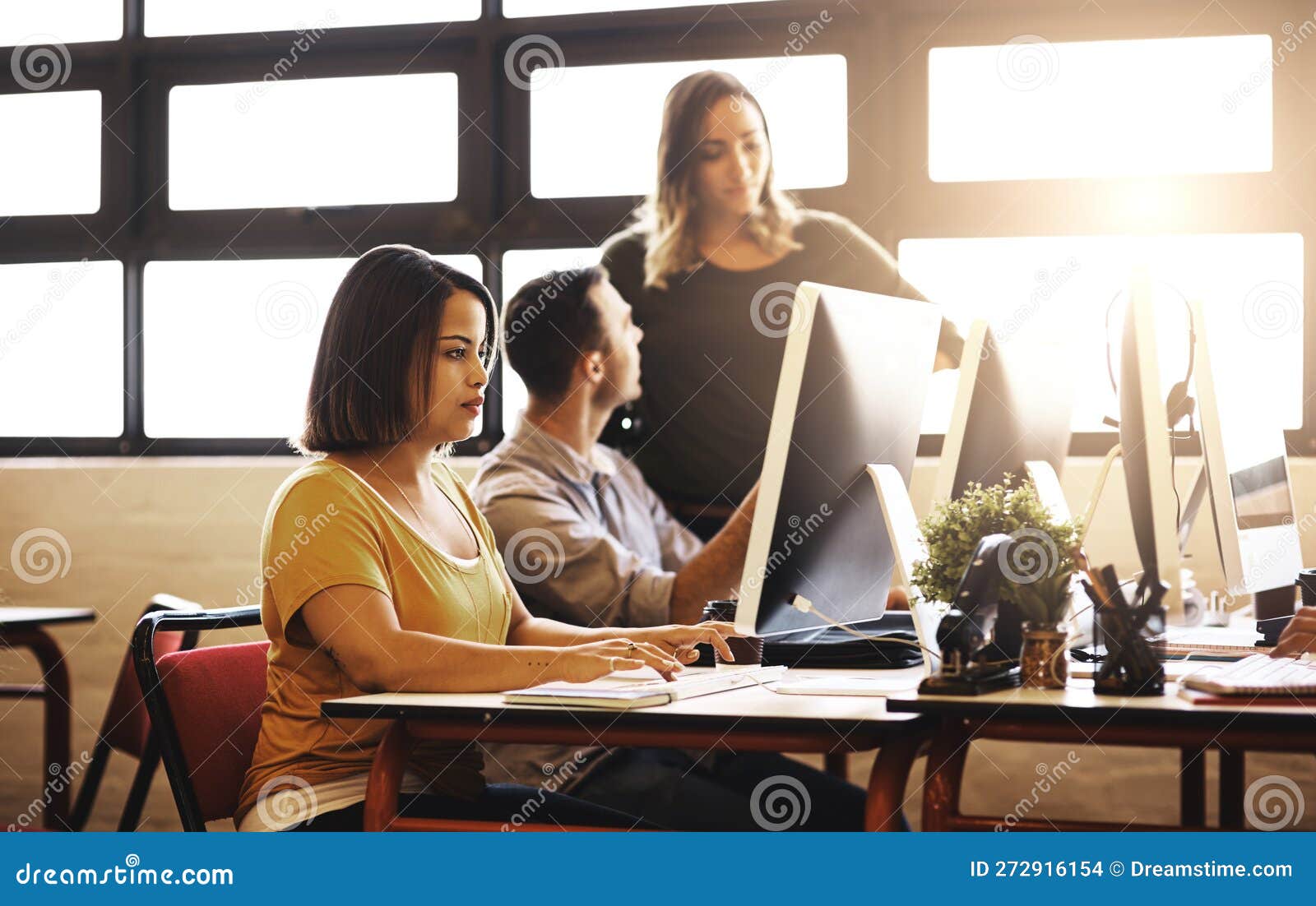 Doing Great Work Together. Colleagues Discussing Something on a ...