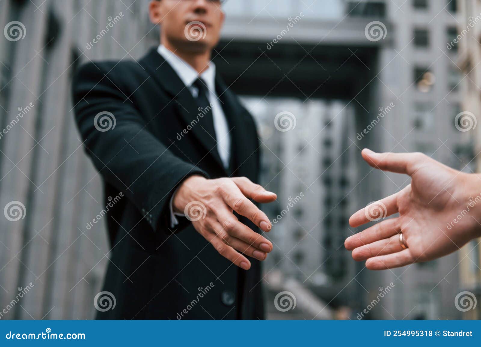 Doing Handshake. Businessman in Black Suit and Tie is Outdoors in the ...