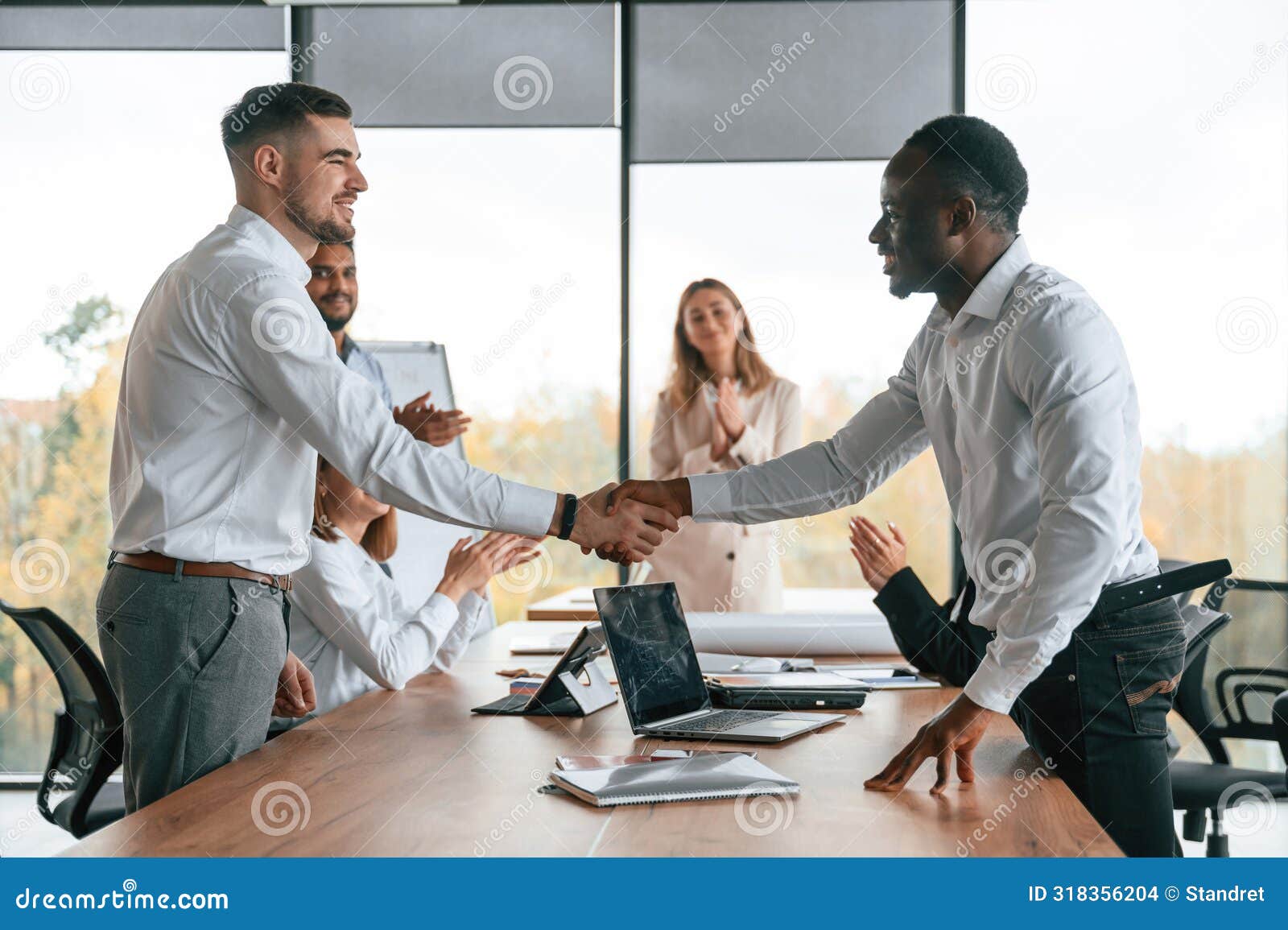 Doing Handshake. Group of Office Workers are Together Indoors Stock ...