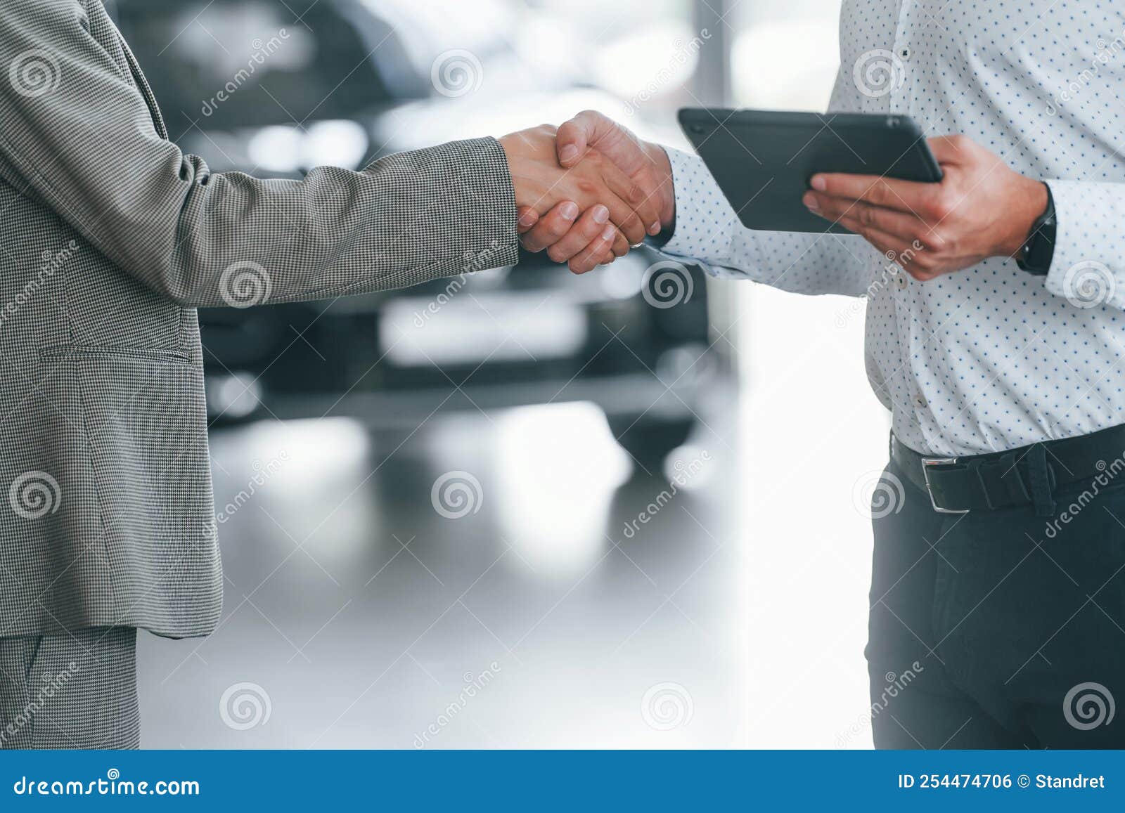 Doing Handshake. Man in Formal Wear Helping Customer with Choice of the ...
