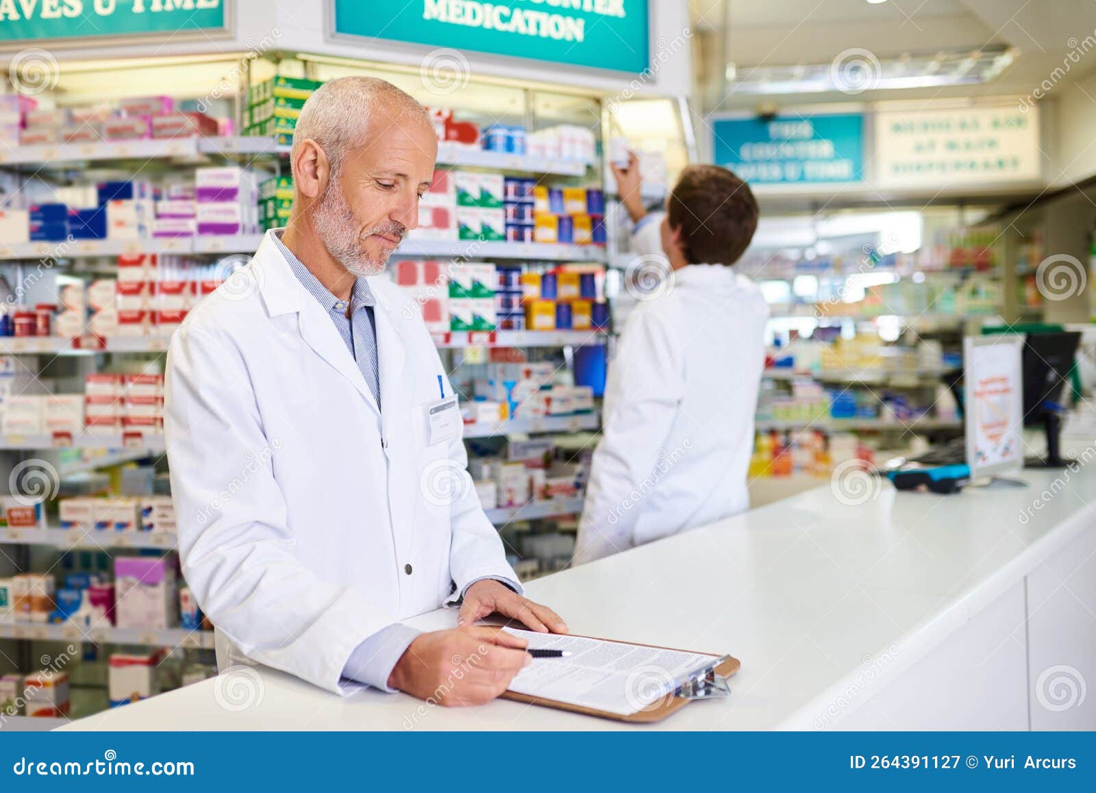 Doing His daily Checkup on His Pharmaceutical Inventory. a Mature ...