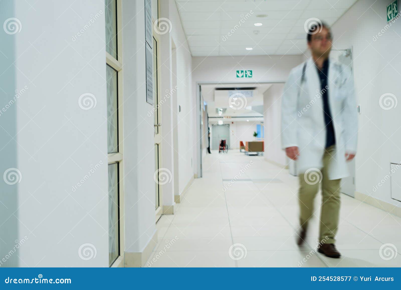 Doing His Hospital Rounds. a Doctor Walking in the Corridor of a ...