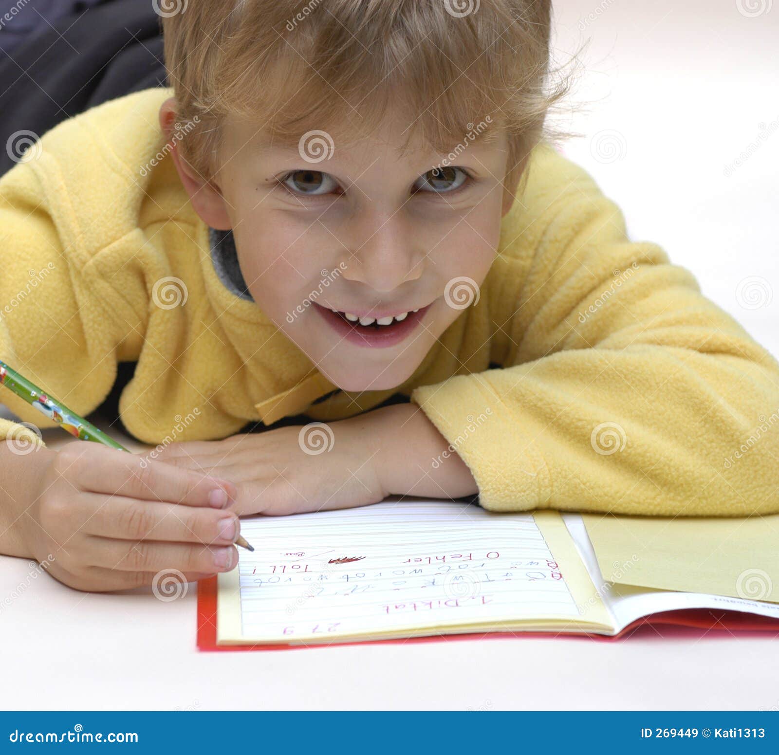 Doing homework stock image. Image of blond, smiles, writing - 269449