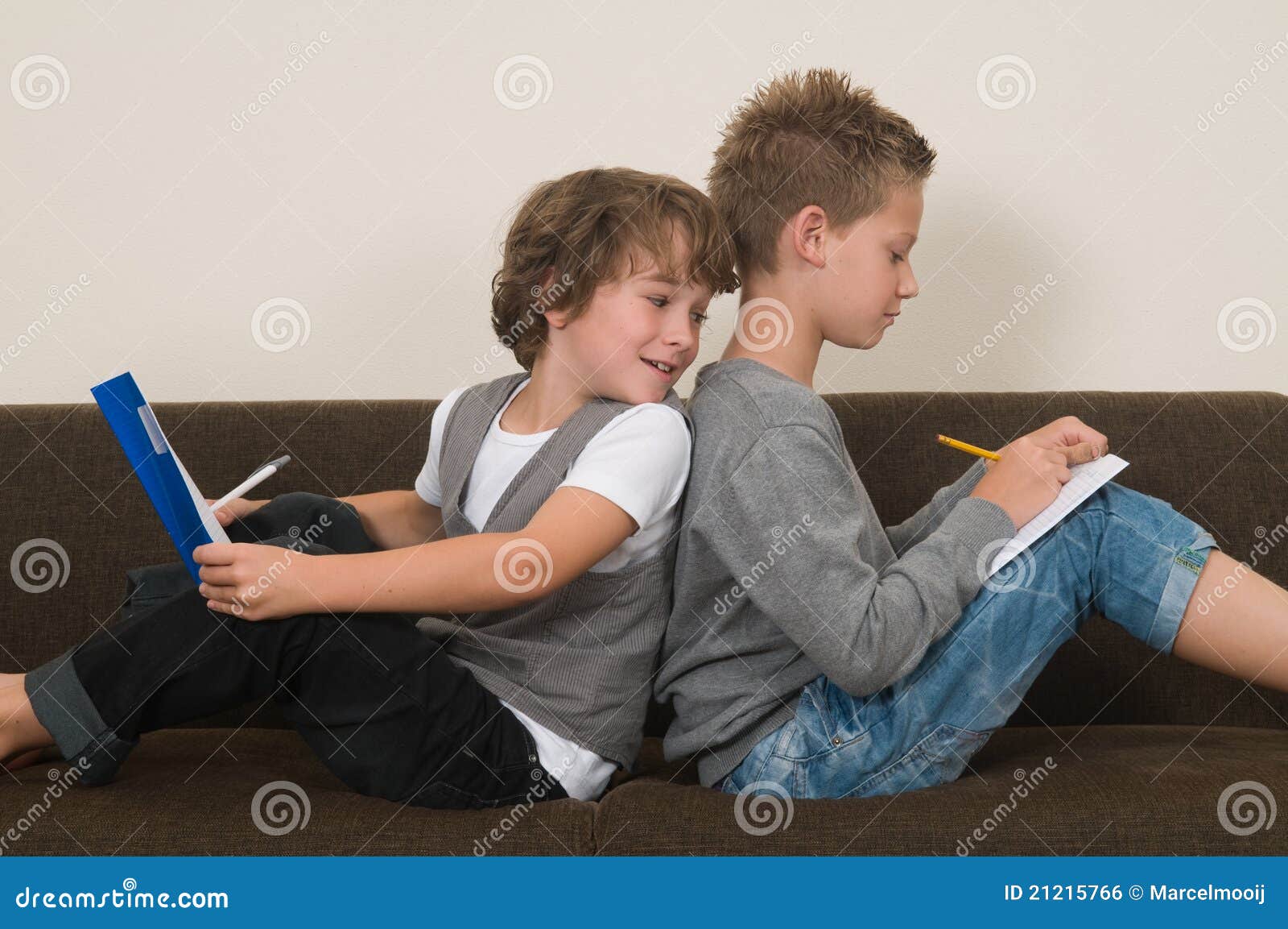 Doing Homework on the Couch Stock Photo - Image of concept, paper: 21215766