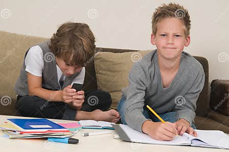 Doing Homework while Gaming Stock Photo - Image of growing ...