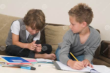 Doing Homework while Gaming Stock Photo - Image of jealousy, livingroom ...