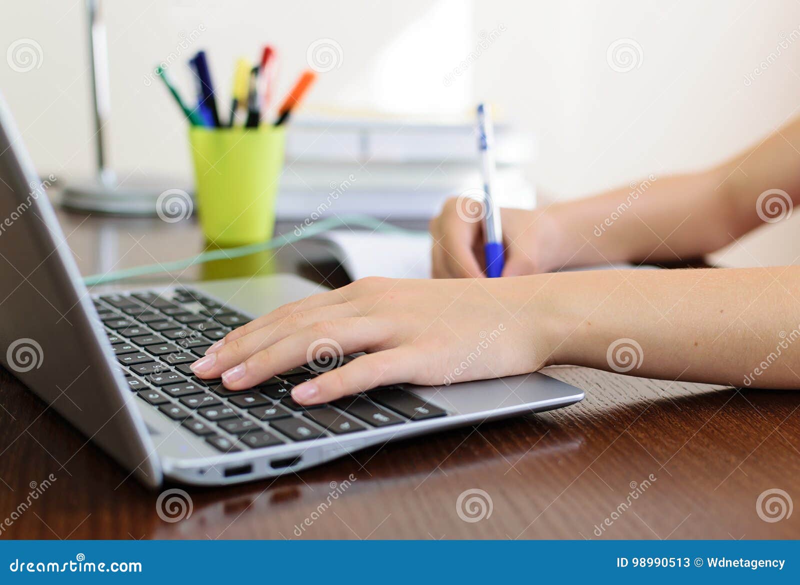 Doing homework on a laptop stock image. Image of school - 98990513