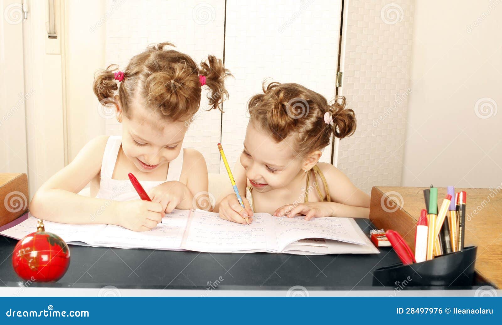 Doing homework together stock photo. Image of childhood - 28497976