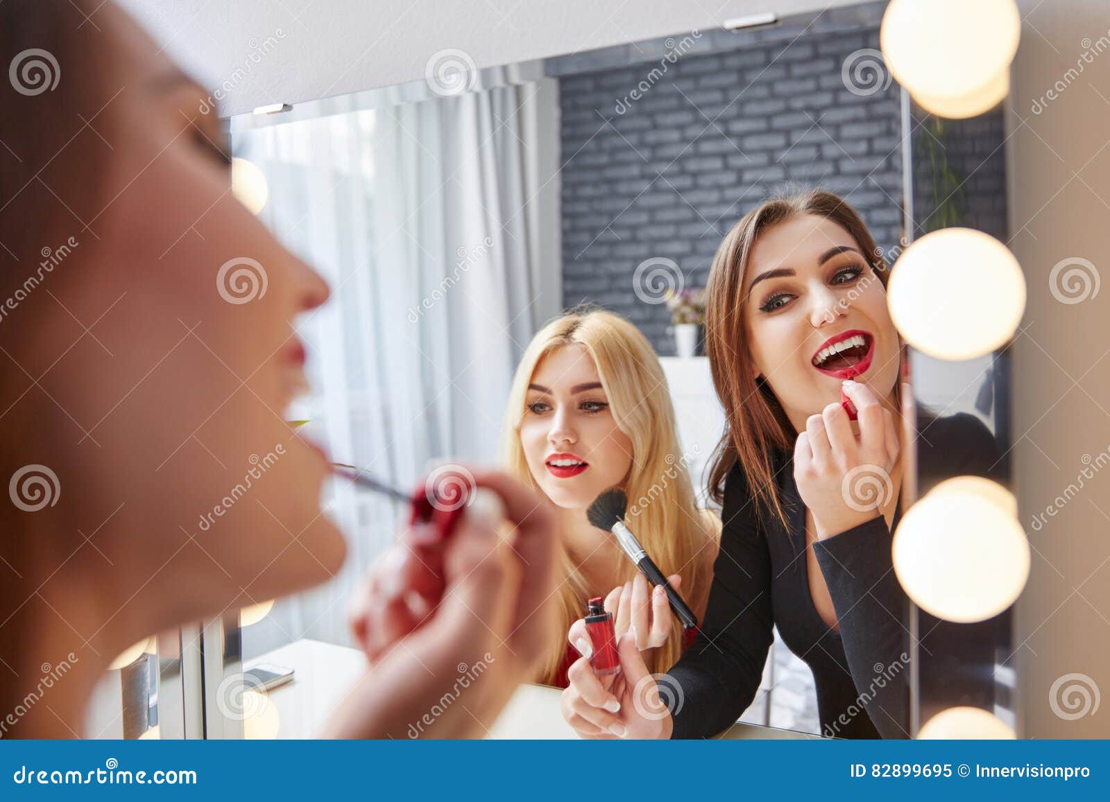 Doing makeup can be fun stock image. Image of expression - 82899695