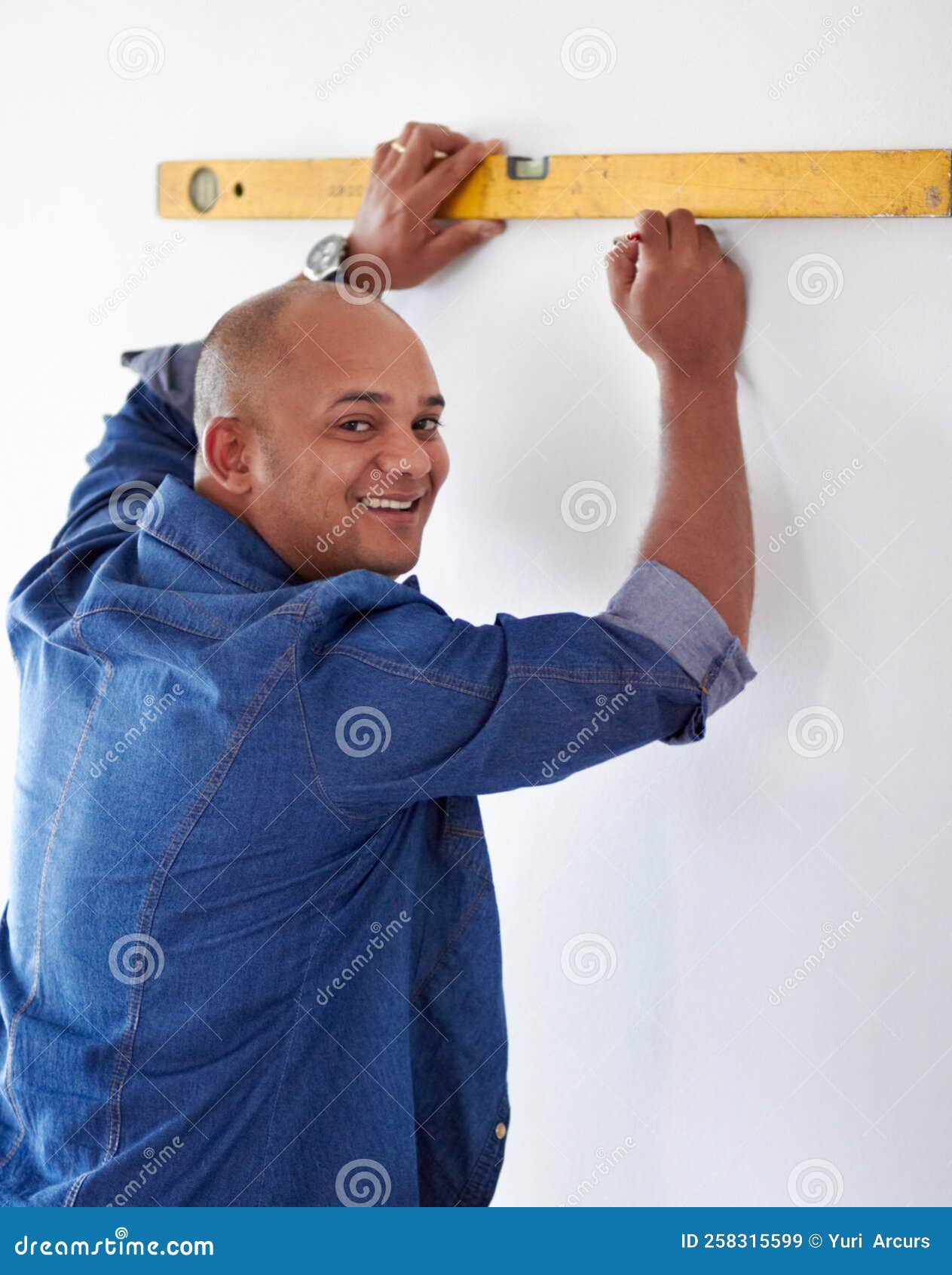 Doing the Measuring. a Handyman Doing Measurements with a Spirit Meter ...