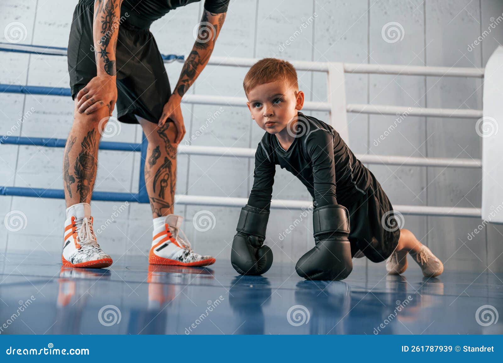 Doing Push Ups. Coach is Teaching the Boy Box Techniques Indoors Stock ...