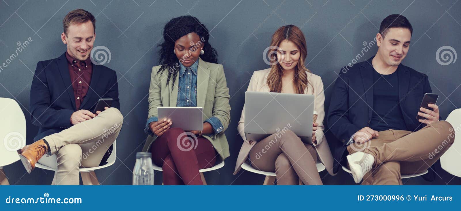 Doing Research for the Job. a Group of Businesspeople Using Different ...