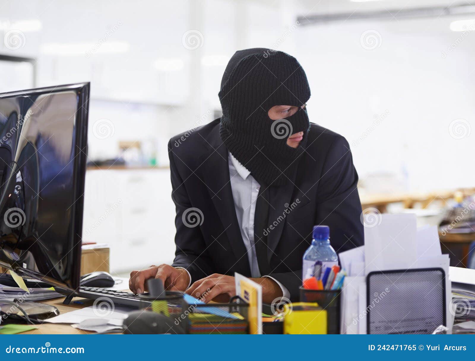 Doing Some Illegal Activities.... Shot of a Hacker Dressed in a Black ...