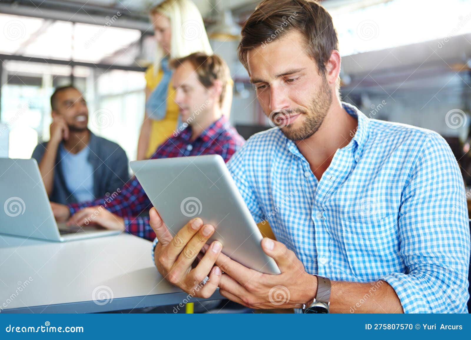 Doing Some Online Research. a Designer Using a Digital Tablet with ...