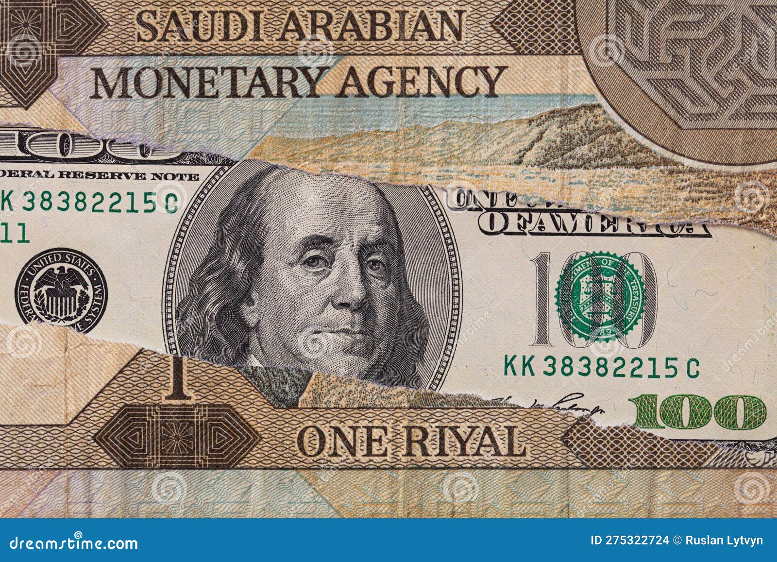 100 Dollar Banknote through Torn Saudi Riyal Banknote Stock Photo ...