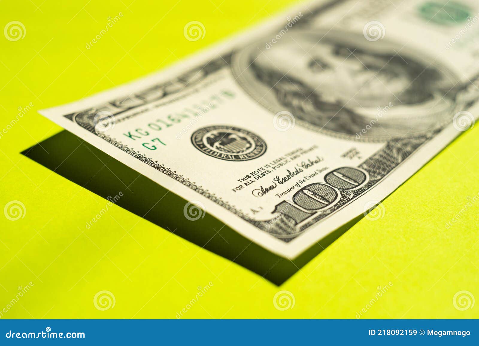 100 Dollar Bill on a Bright Green Table Close-up Stock Image - Image of ...