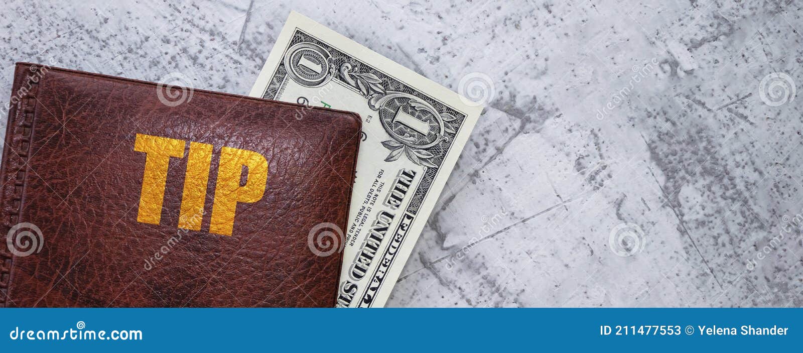 Dollar Bill Lying in the Cover with the Inscription: Tip. One Dollar in ...