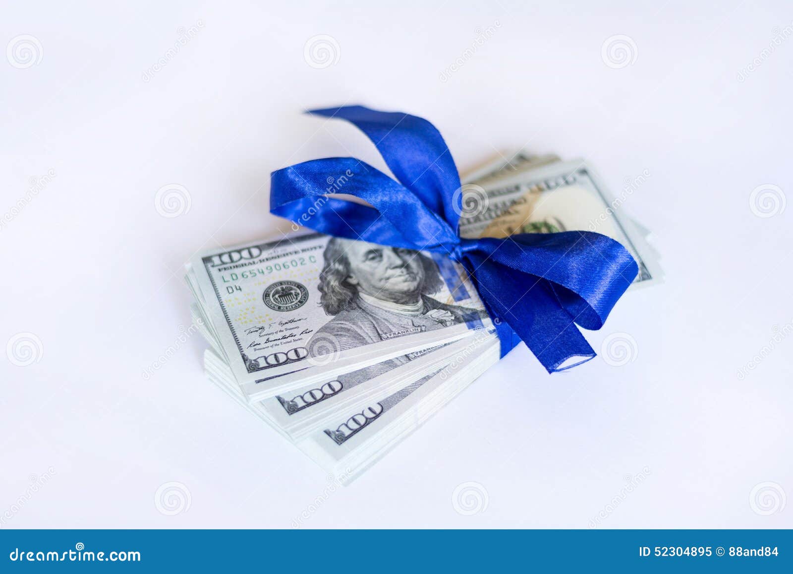 100 Dollar Bills with Blue Ribbon on a White Background Stock Image ...