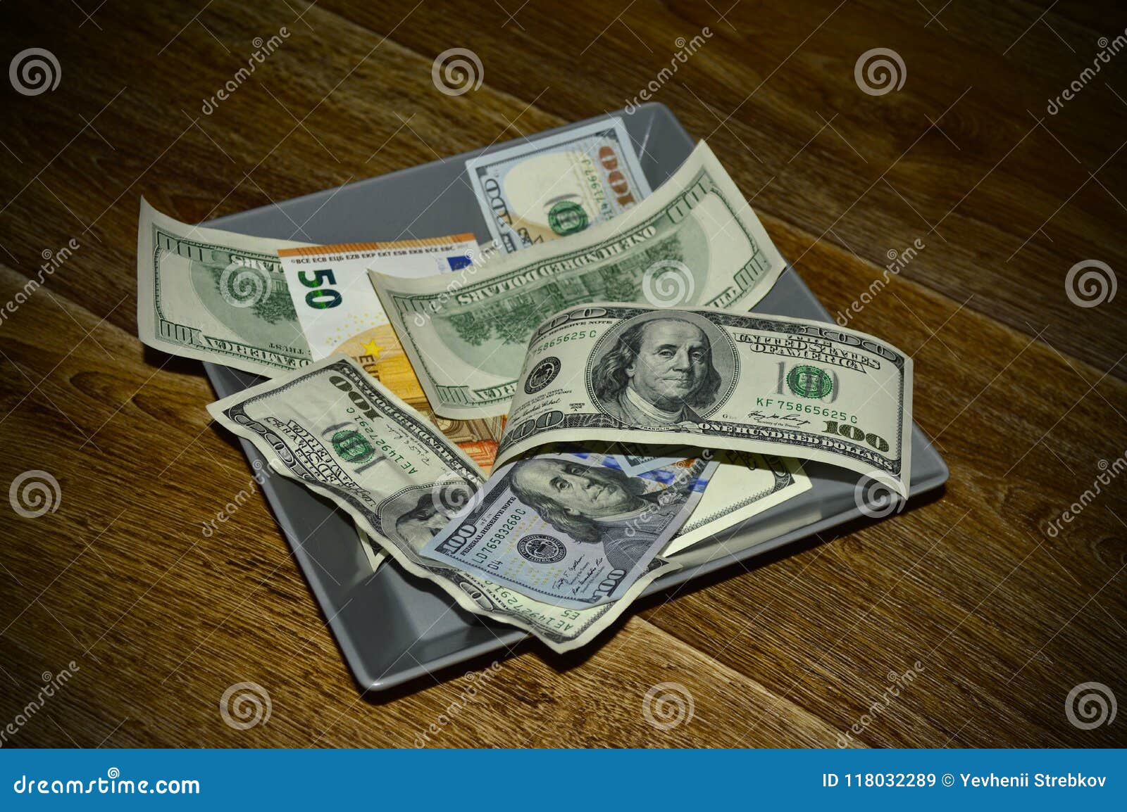 Dollar Bills in a Square Plate Stock Image - Image of roll, savings ...
