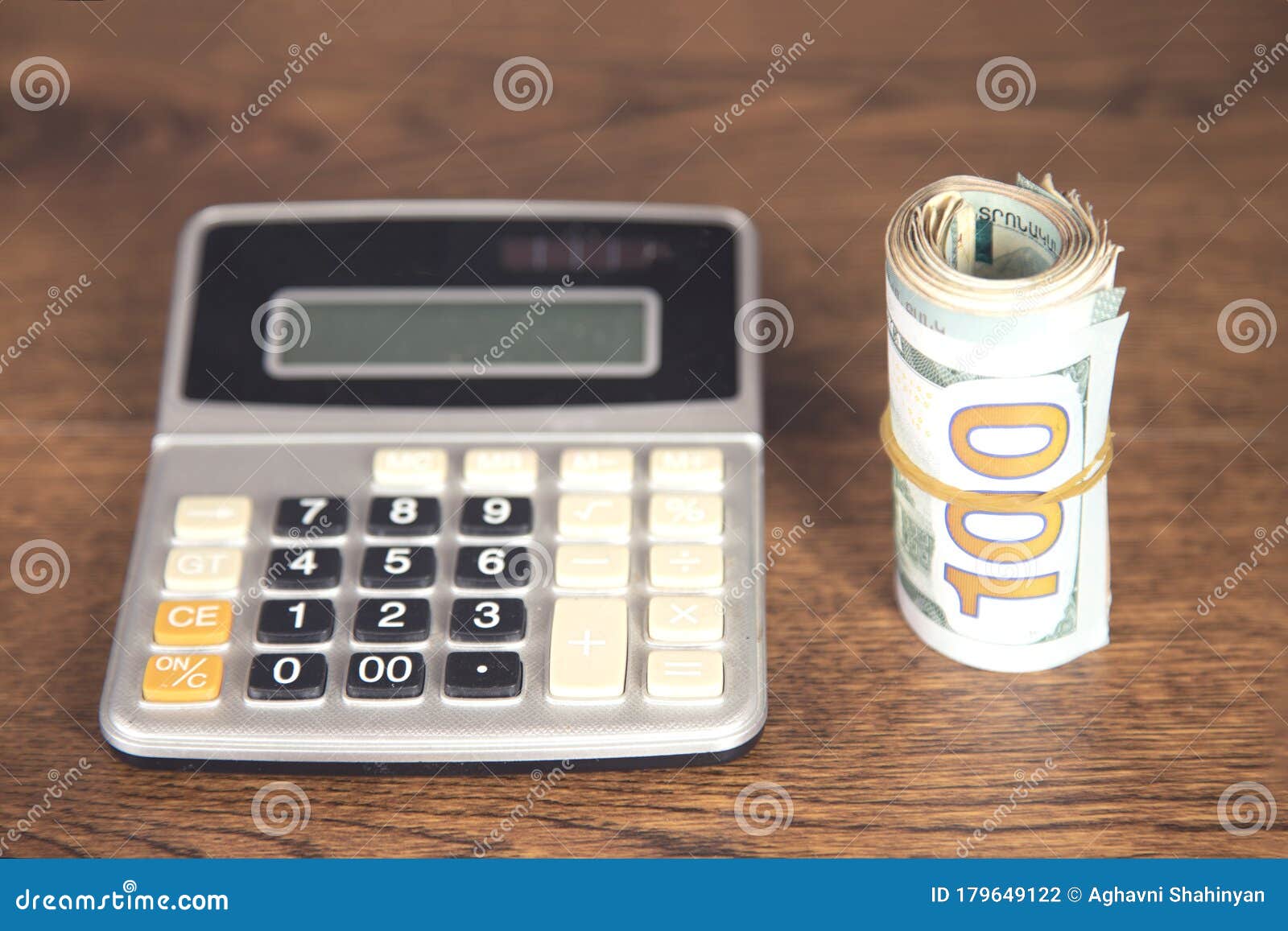 Dollar and Calculator on Table Stock Photo - Image of desk, work: 179649122