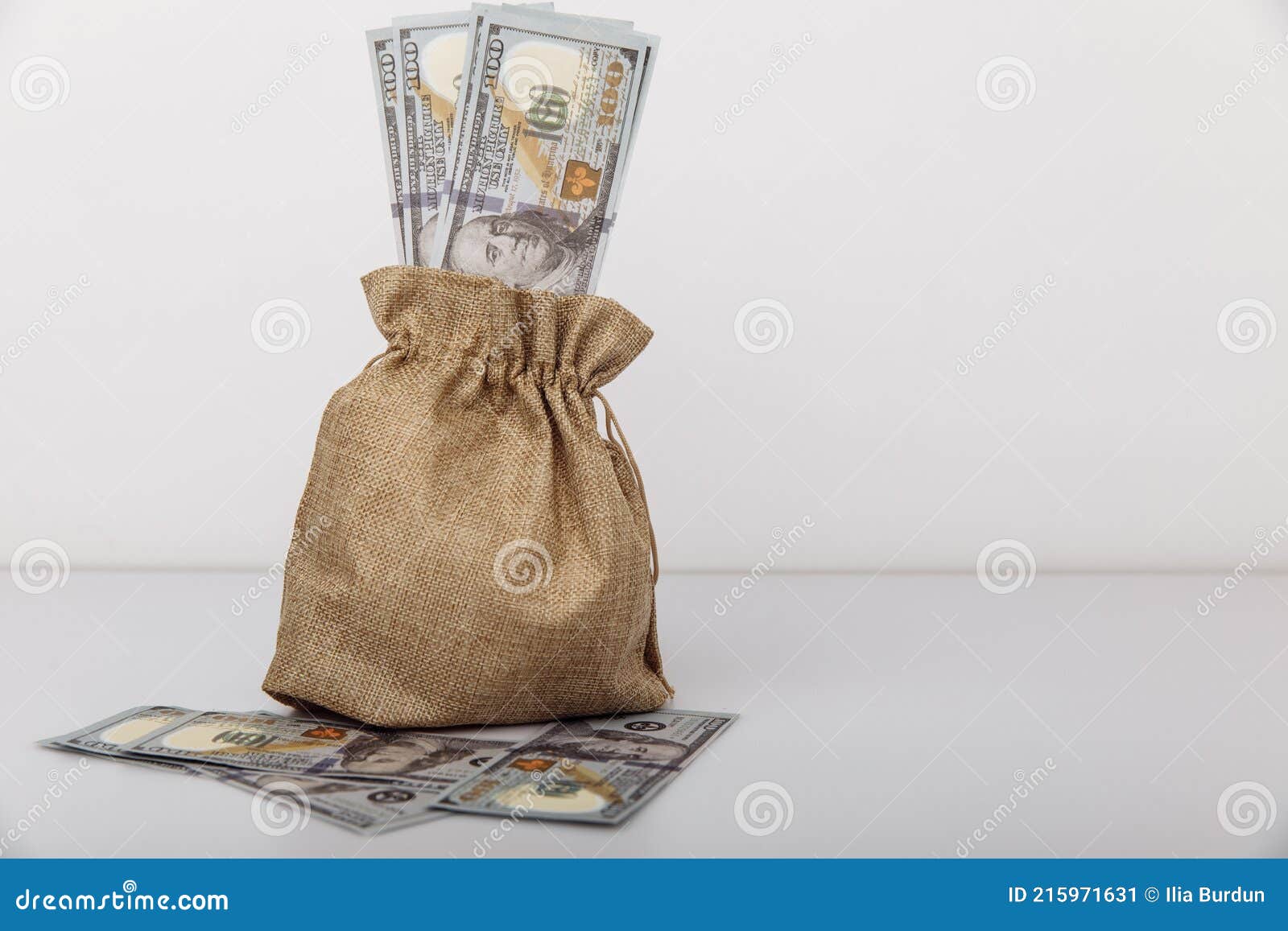 Dollar Money Bag on a White Table Stock Image - Image of moneybag ...