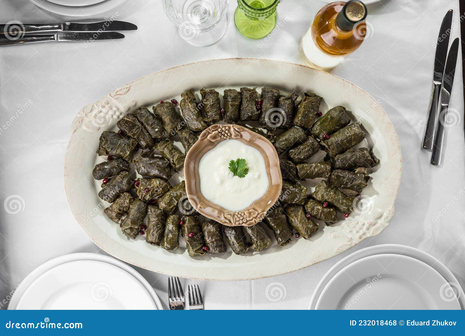 Dolma Grape Leaves with Sauce on a Clay Plate on the Table Stock Photo ...