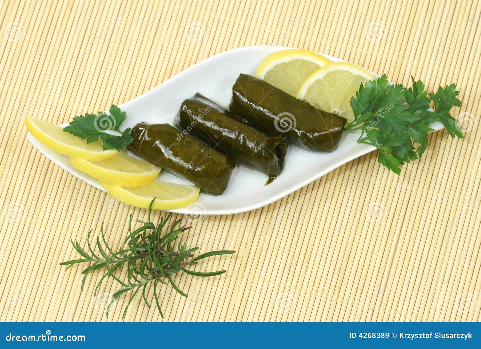Greek Dolmadakia. Rice And Meat Wrapped In Grape Leaves. White Plate ...