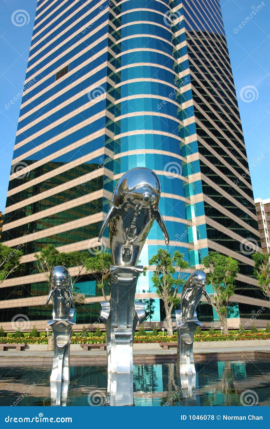 Dolphin Statue and Business Building Stock Photo - Image of structure ...