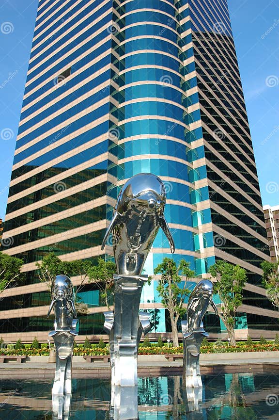 Dolphin Statue and Business Building Stock Photo - Image of structure ...