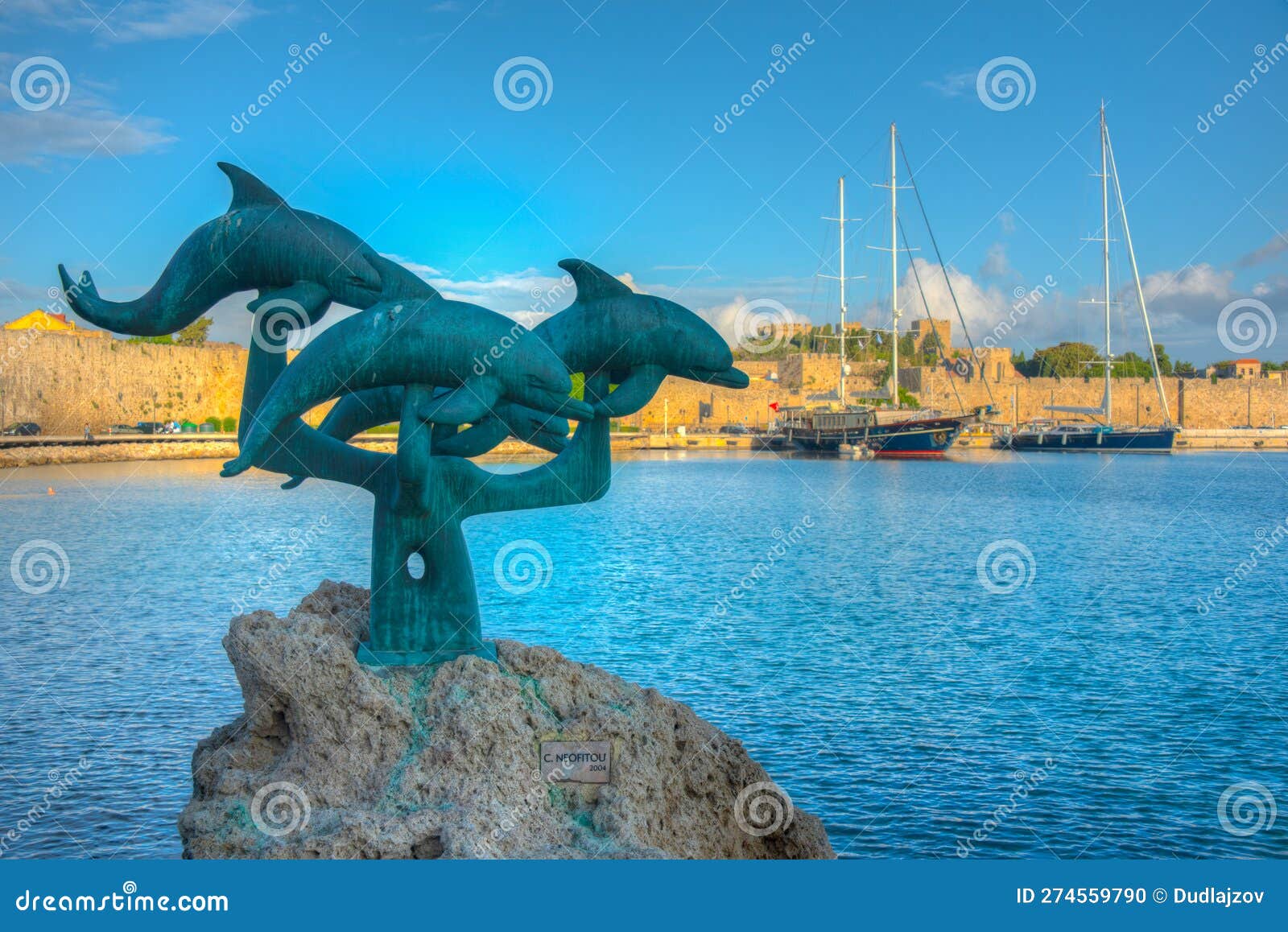 Dolphin Statue in Front of an Ancient Fortification at Rhodes in ...