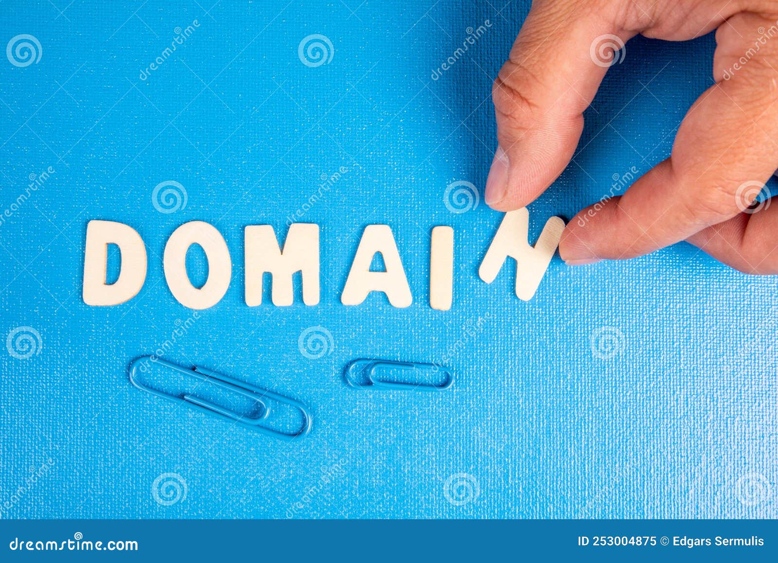 Domain. Text from White Wooden Letters on a Blue Background Stock Image ...