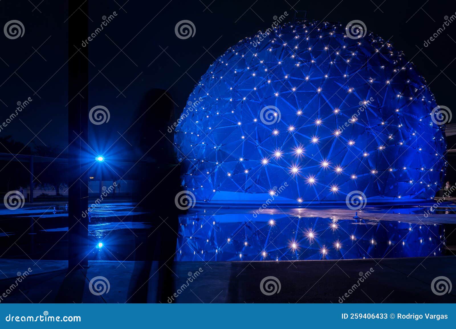 Dome Shaped Building, with Colored Lights, Reflection in Water ...
