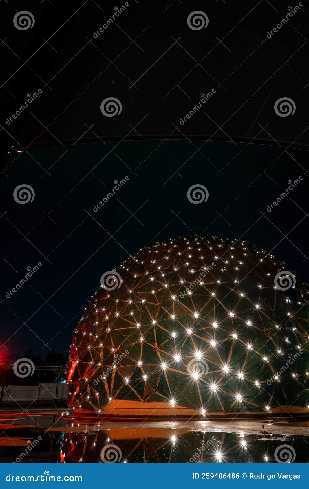 Dome Shaped Building, with Colored Lights, Reflection in Water ...