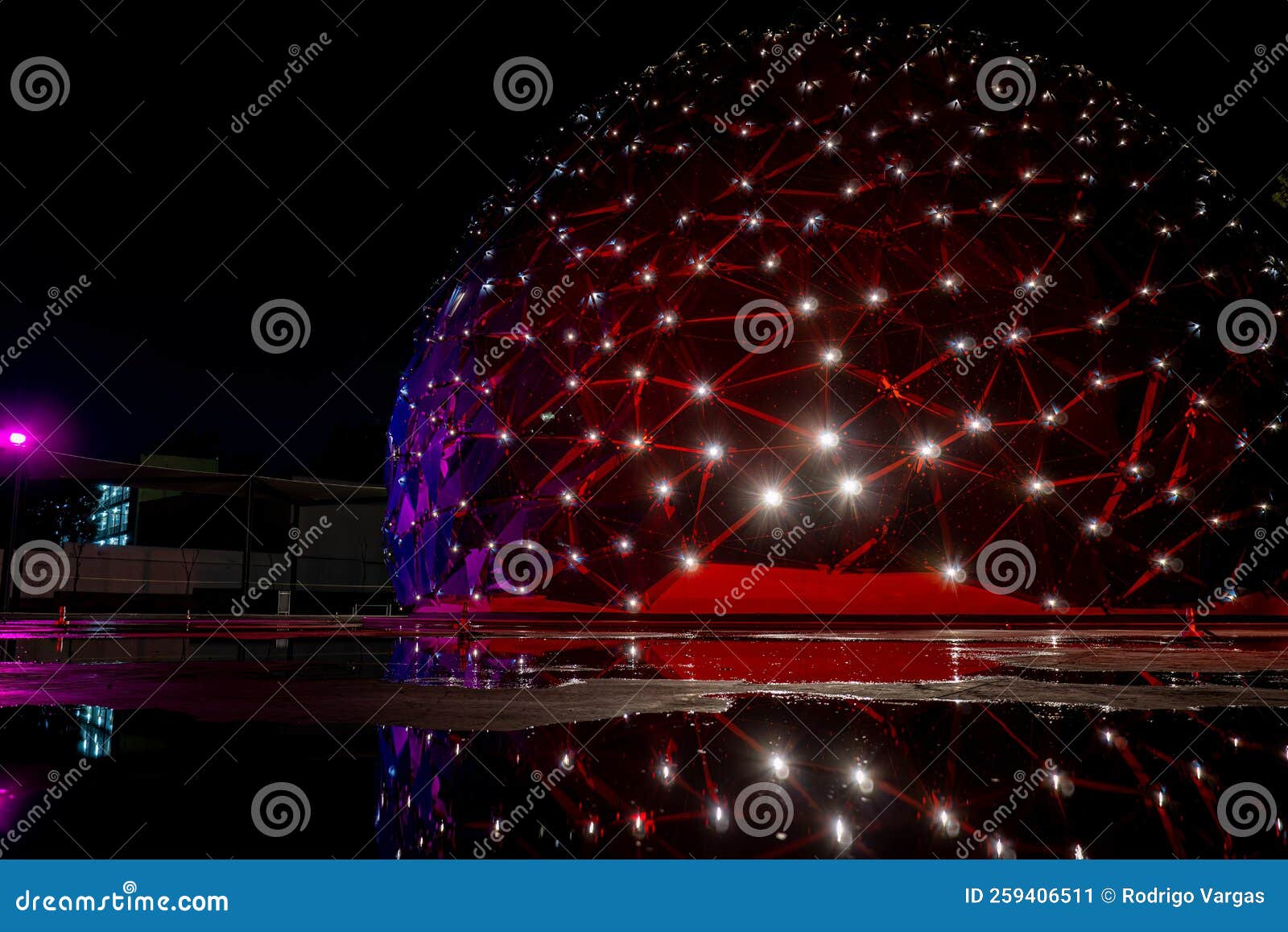 Dome Shaped Building, with Colored Lights, Reflection in Water ...