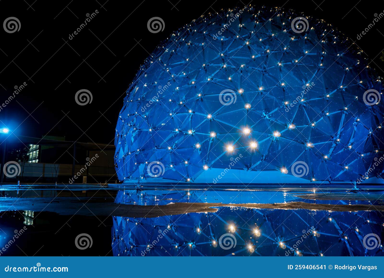 Dome Shaped Building, with Colored Lights, Reflection in Water ...