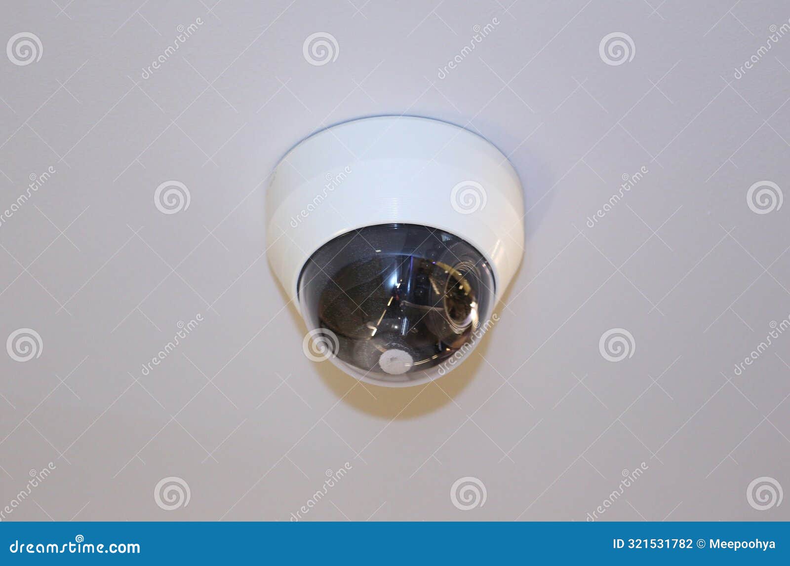 A Dome-shaped CCTV Camera Mounted Under the Ceiling of the Meeting Room ...